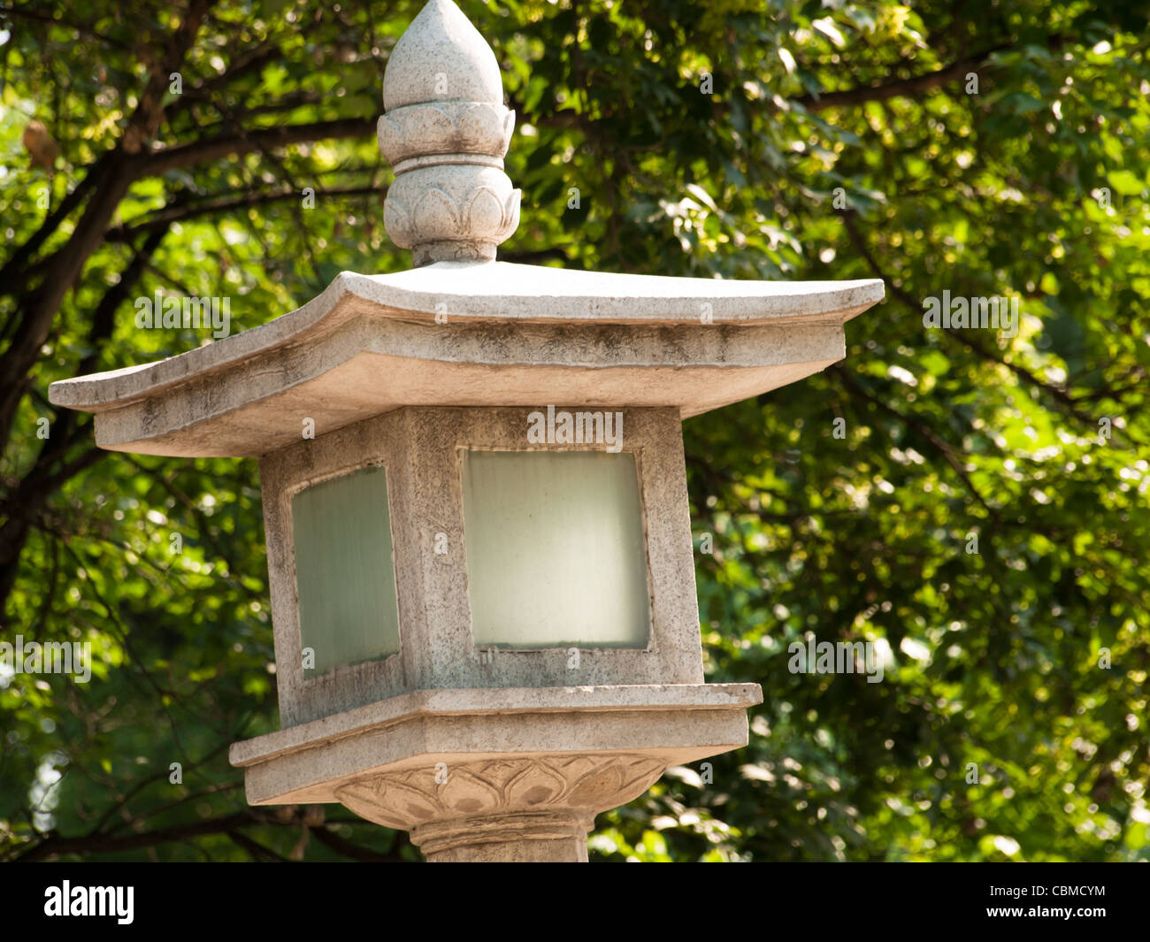 Traditional stone chinese lanter Stock Photo - Alamy