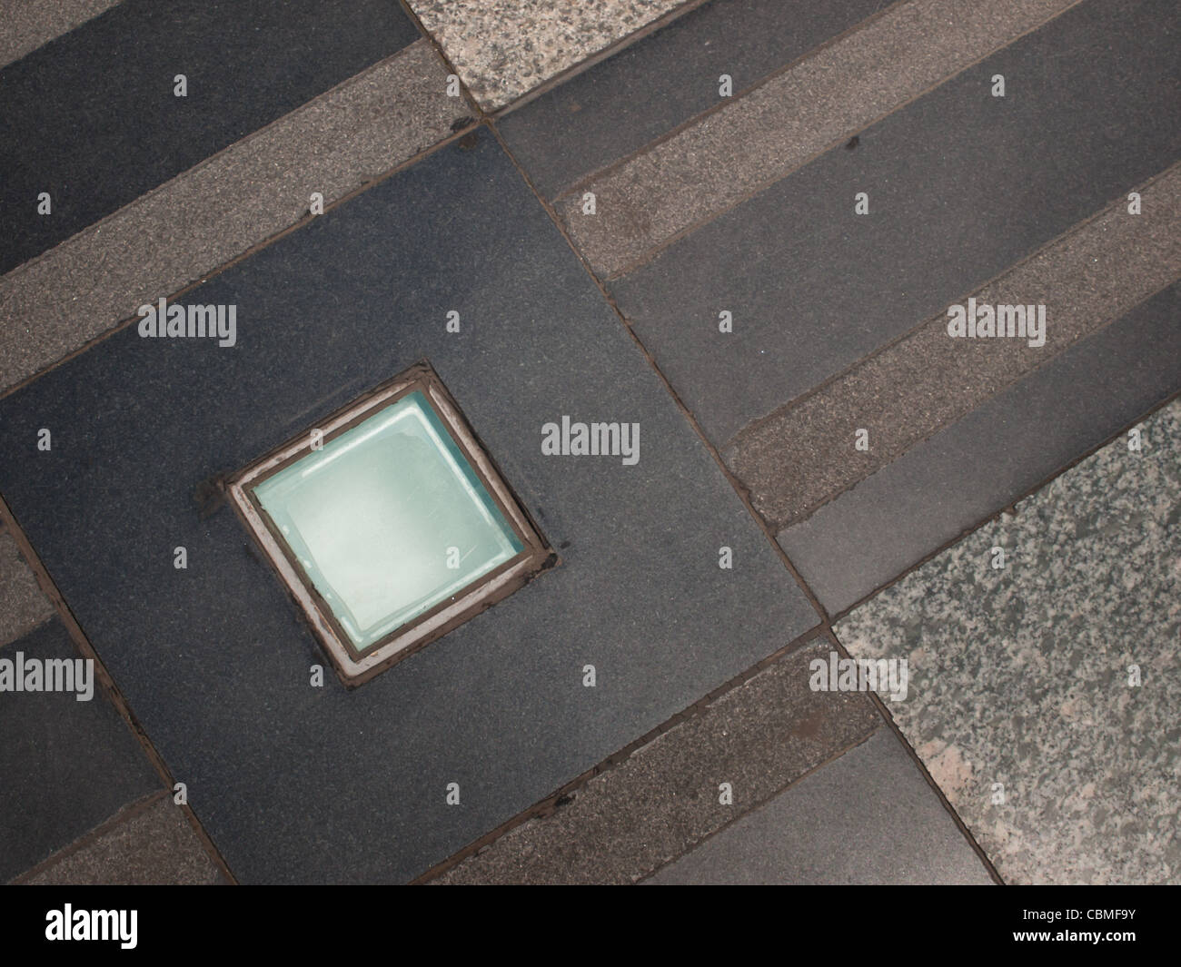 Square light in pavers Stock Photo - Alamy
