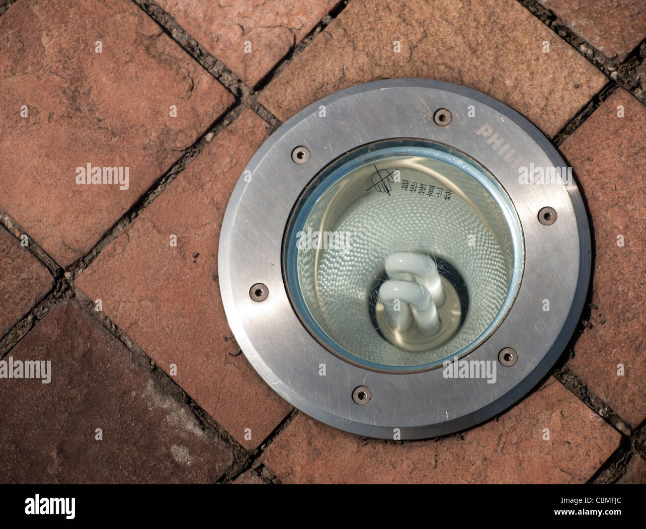 Round light in pavers Stock Photo - Alamy