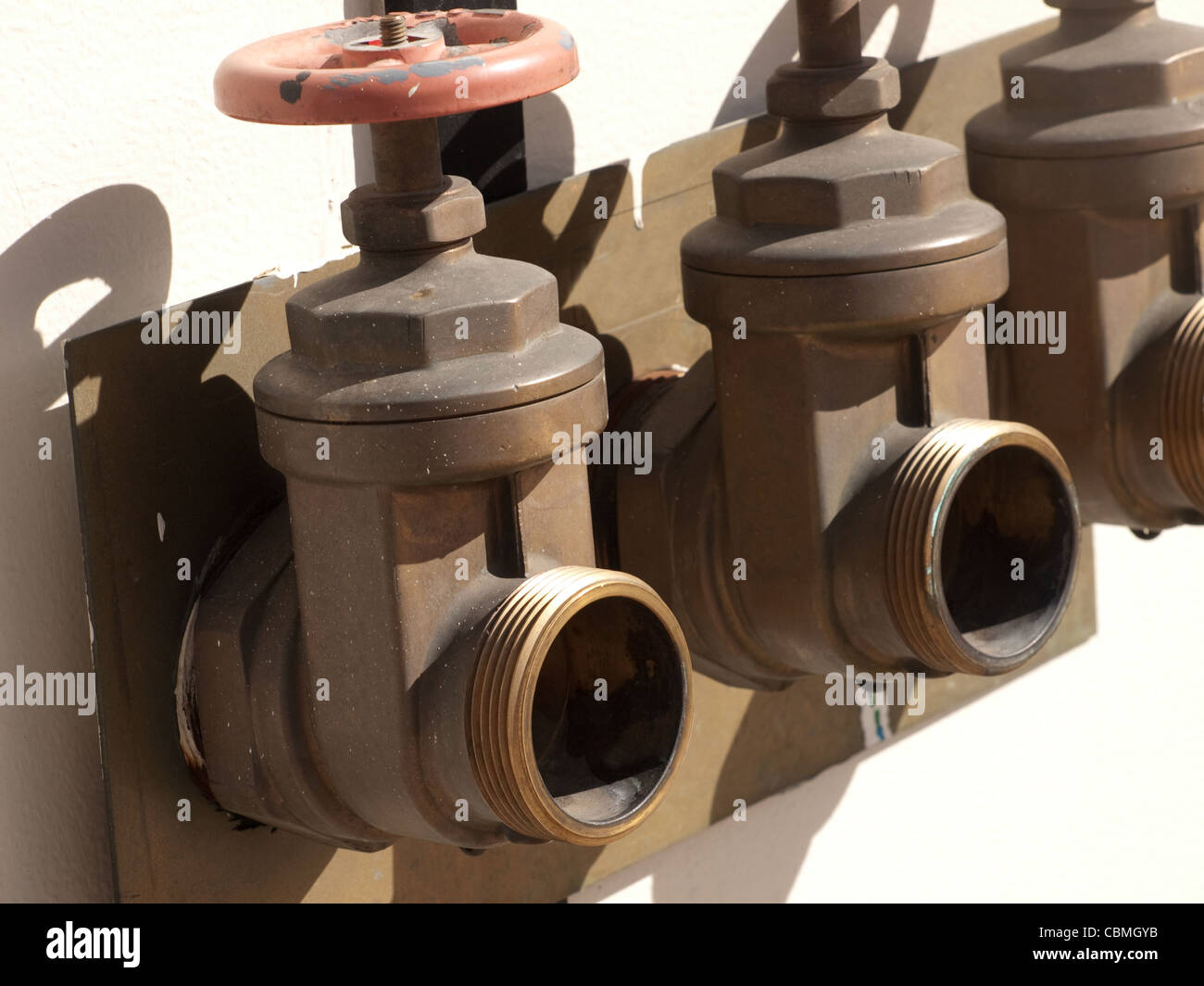 Wall mounted fire hydrant Stock Photo - Alamy