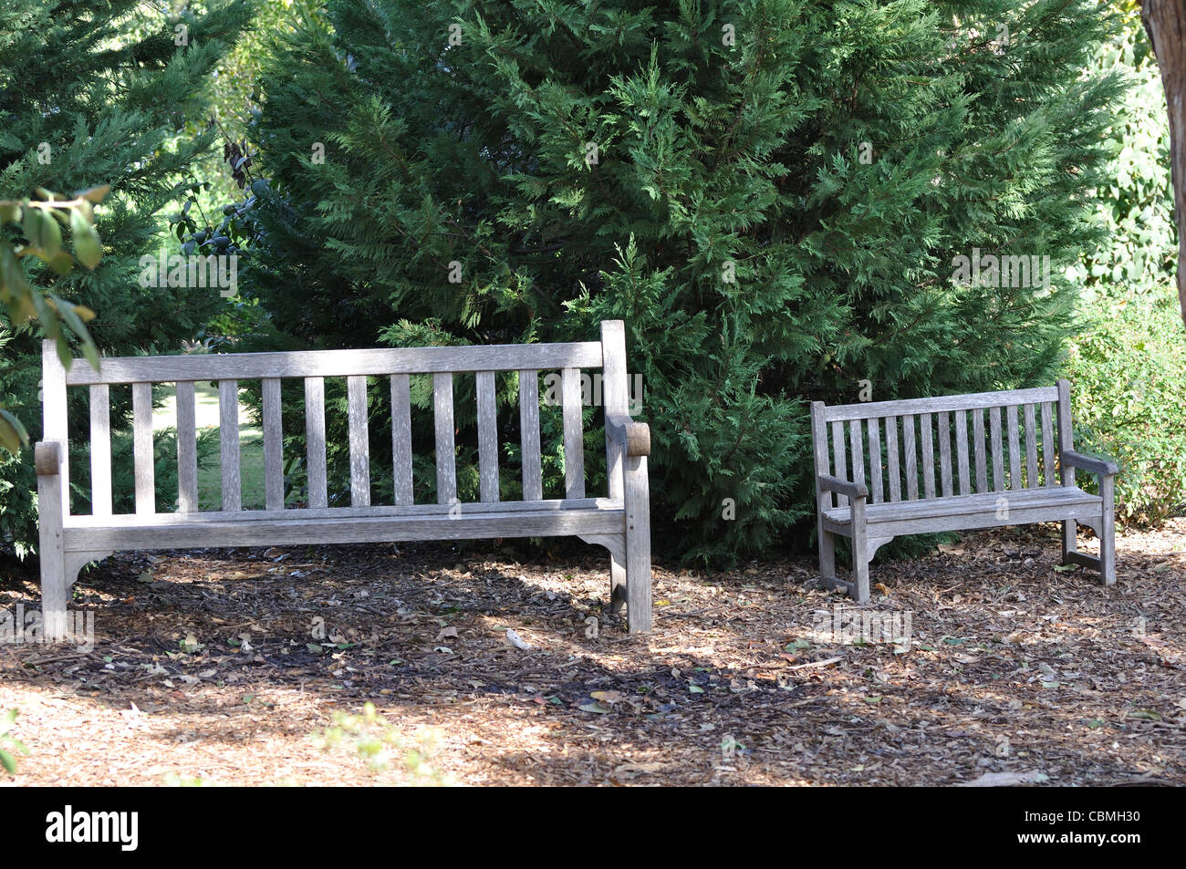Big and small benches in park Stock Photo - Alamy