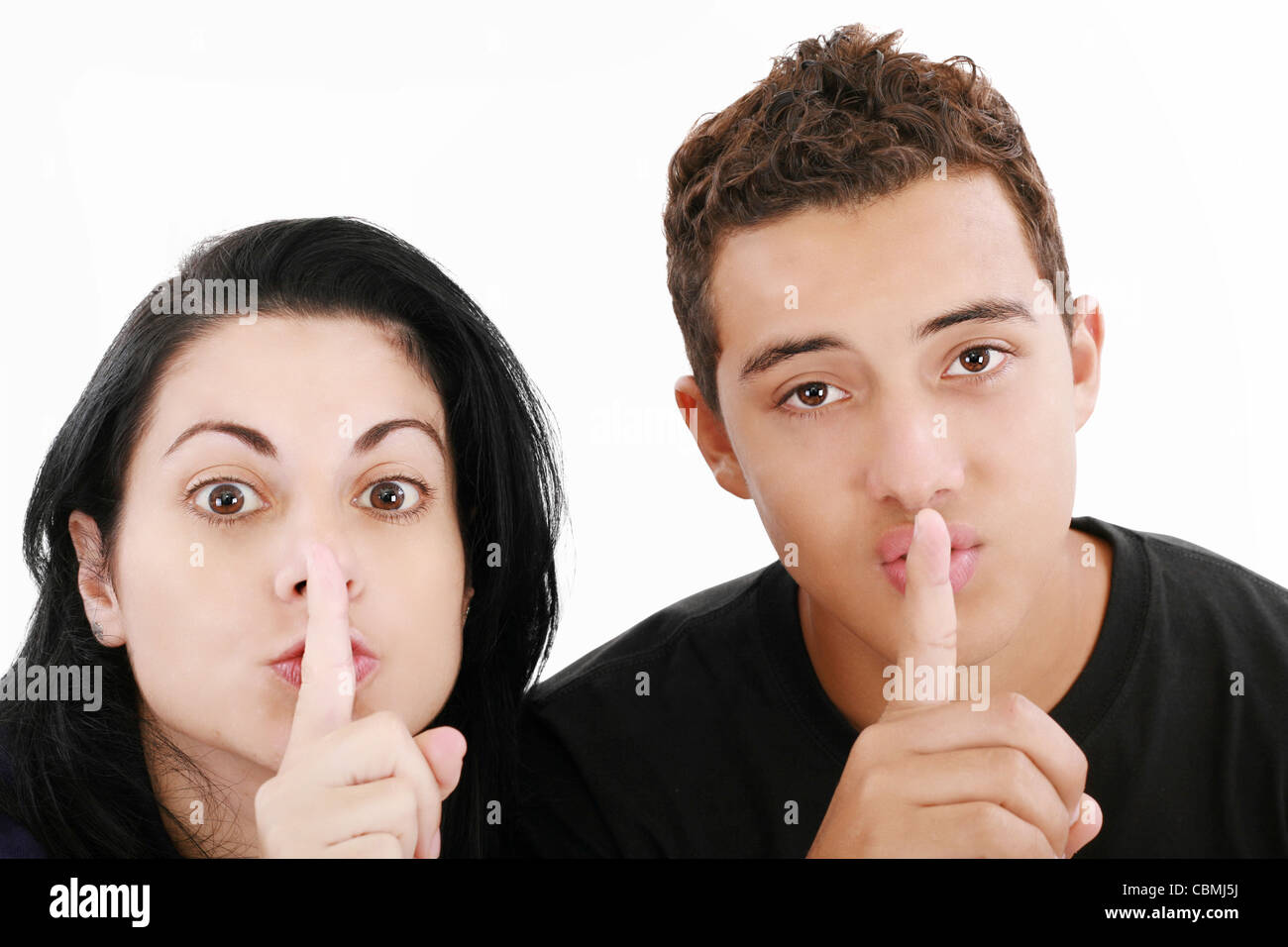 Friends or couple showing silence sign. Isolated on white Stock Photo ...