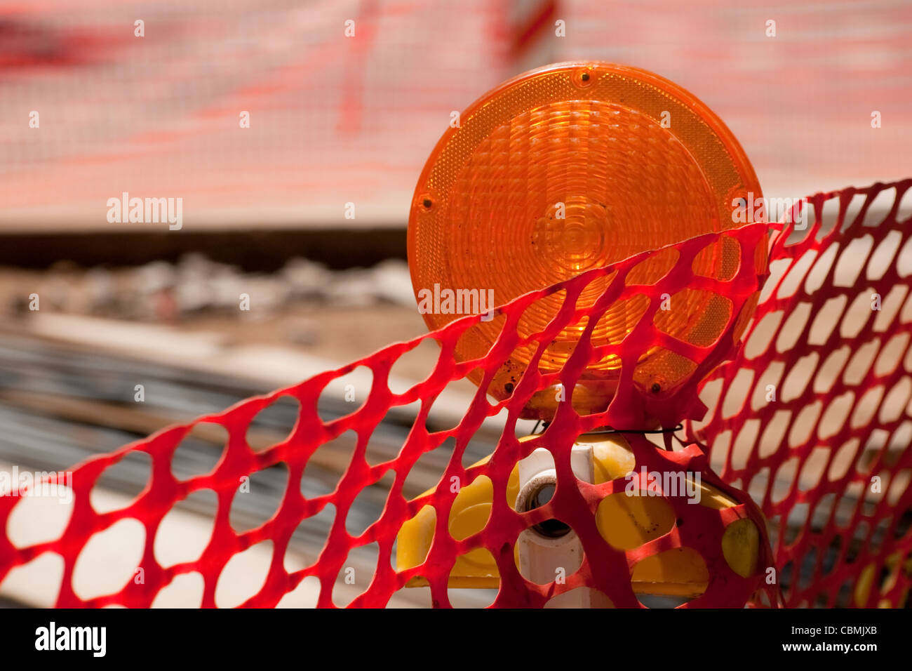 Construction light with orange fence Stock Photo - Alamy