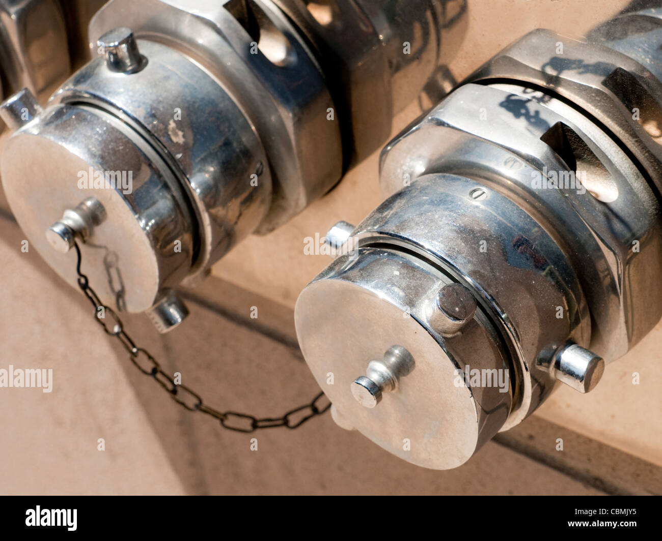 Wall mounted fire hydrant Stock Photo - Alamy