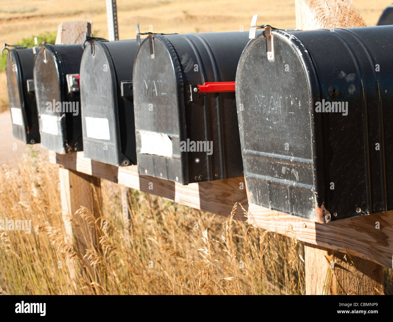 Row of black mailboxes Stock Photo - Alamy