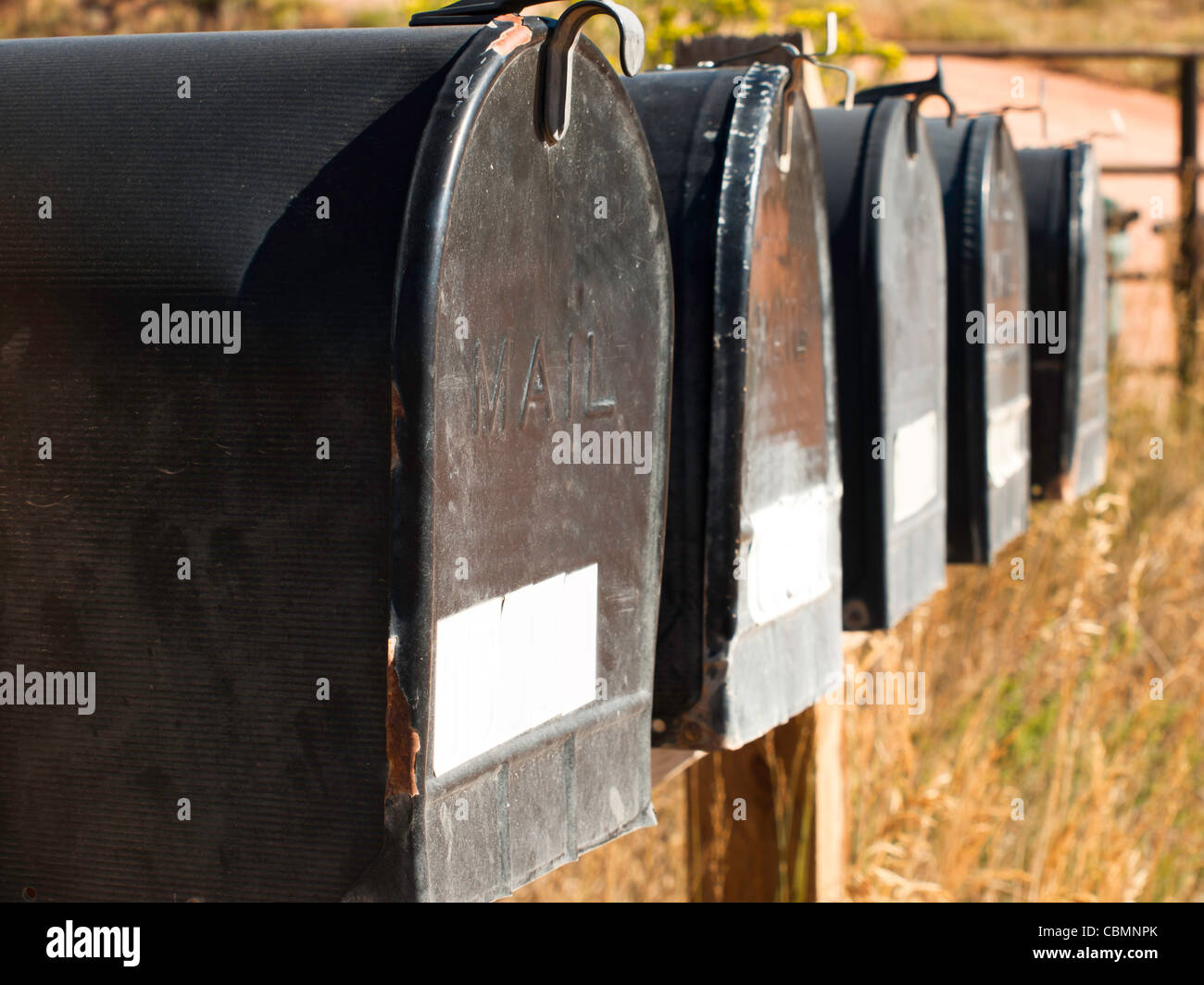 Row of black mailboxes Stock Photo - Alamy