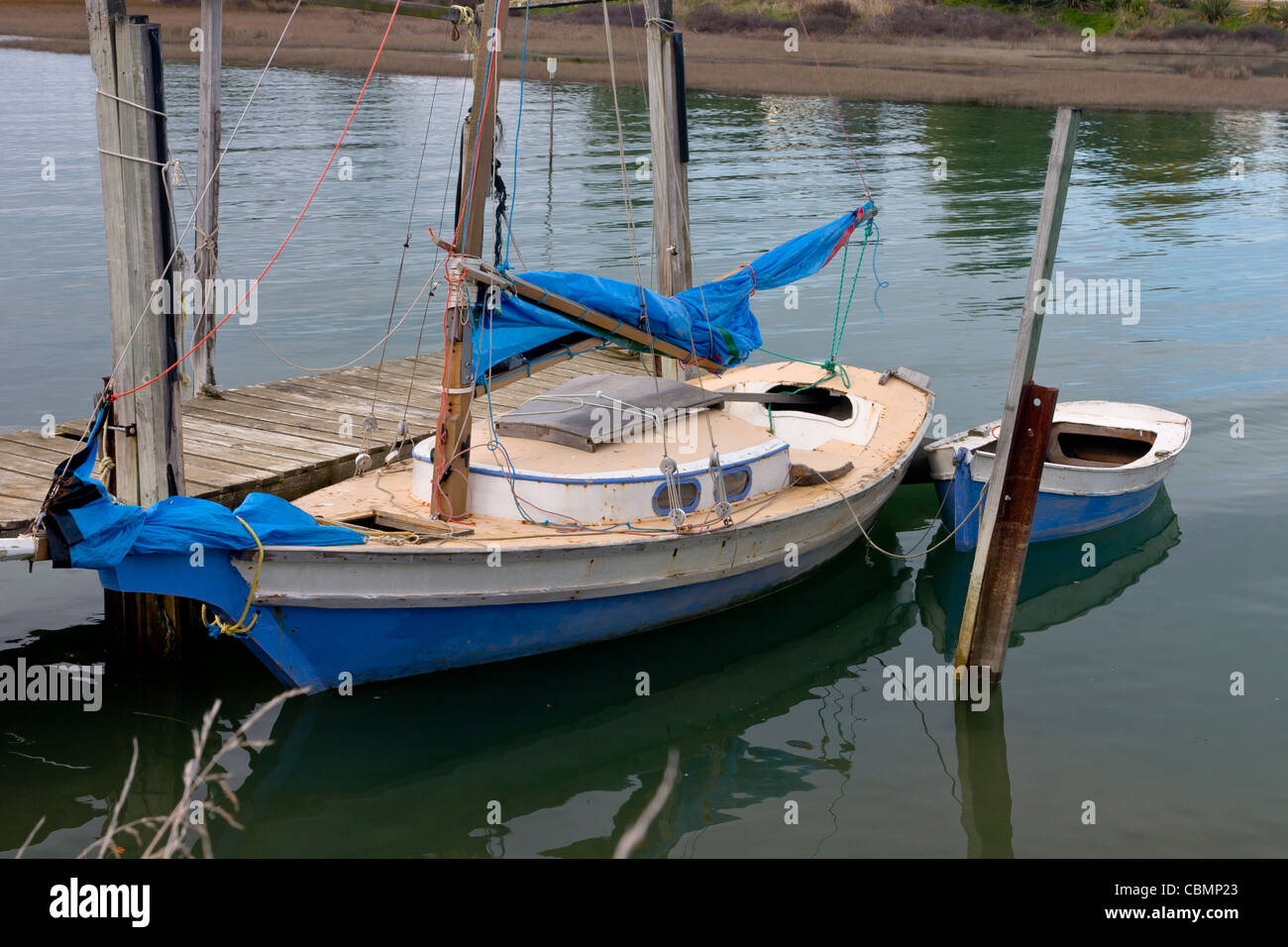 Old wooden yacht and dinghy Stock Photo - Alamy