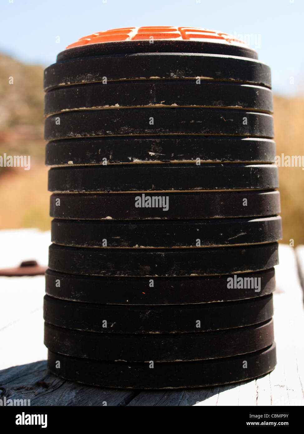 Stack of orange clay pigeons Stock Photo - Alamy