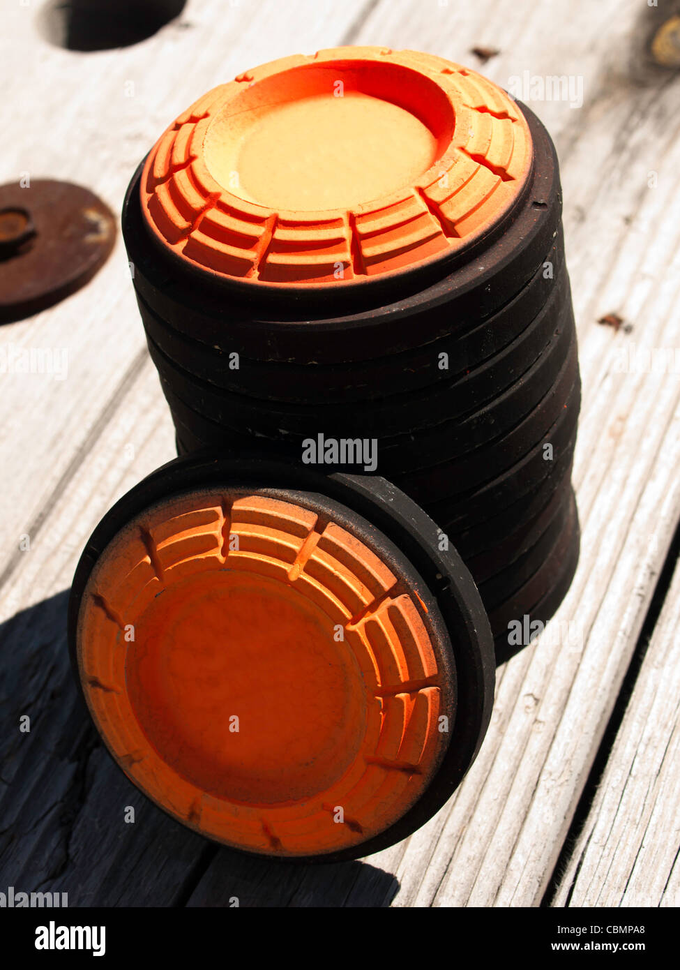 Stack of orange clay pigeons Stock Photo - Alamy