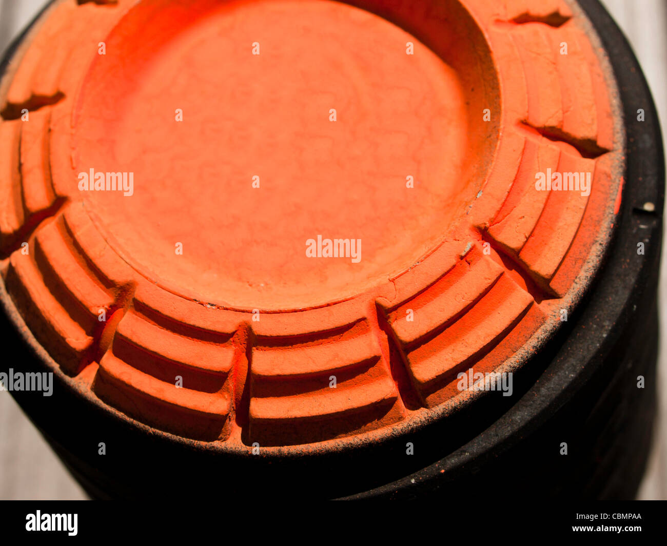 Stack of orange clay pigeons Stock Photo - Alamy