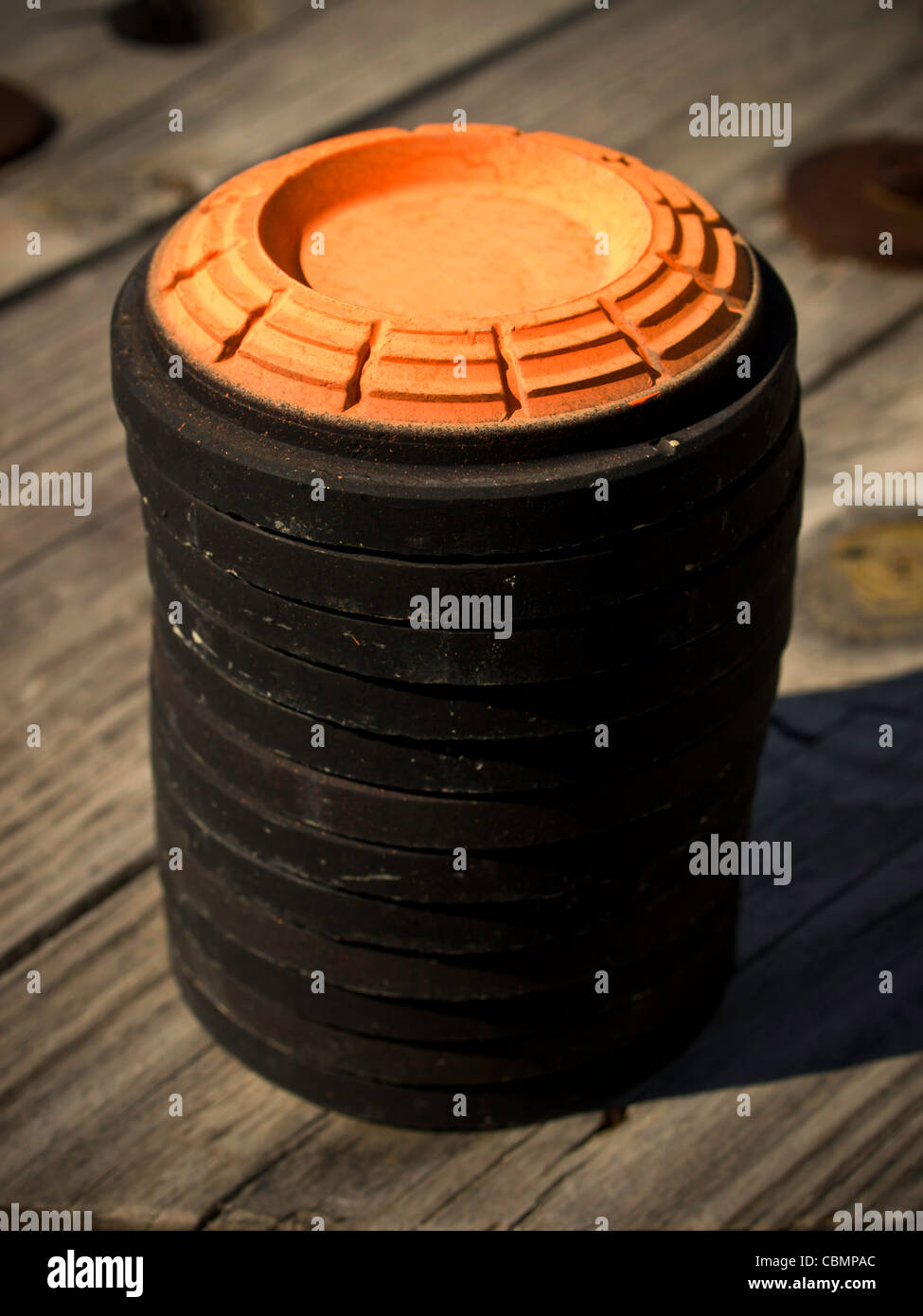 Stack of orange clay pigeons Stock Photo - Alamy