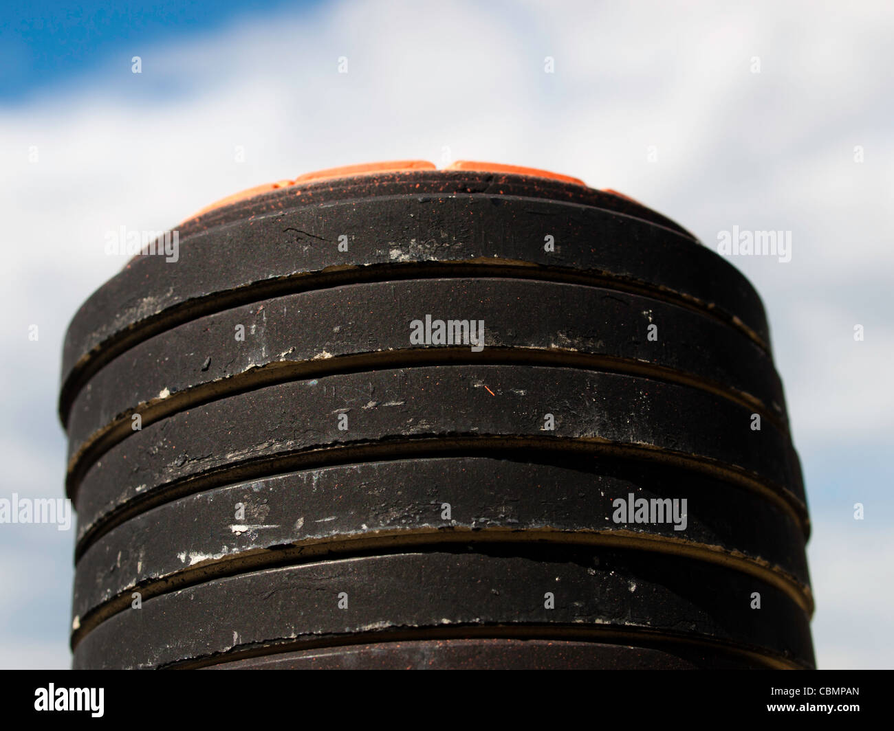 Stack of orange clay pigeons Stock Photo - Alamy