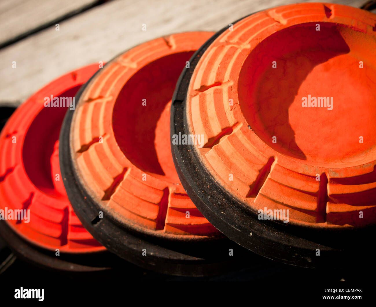 Stack of orange clay pigeons Stock Photo - Alamy
