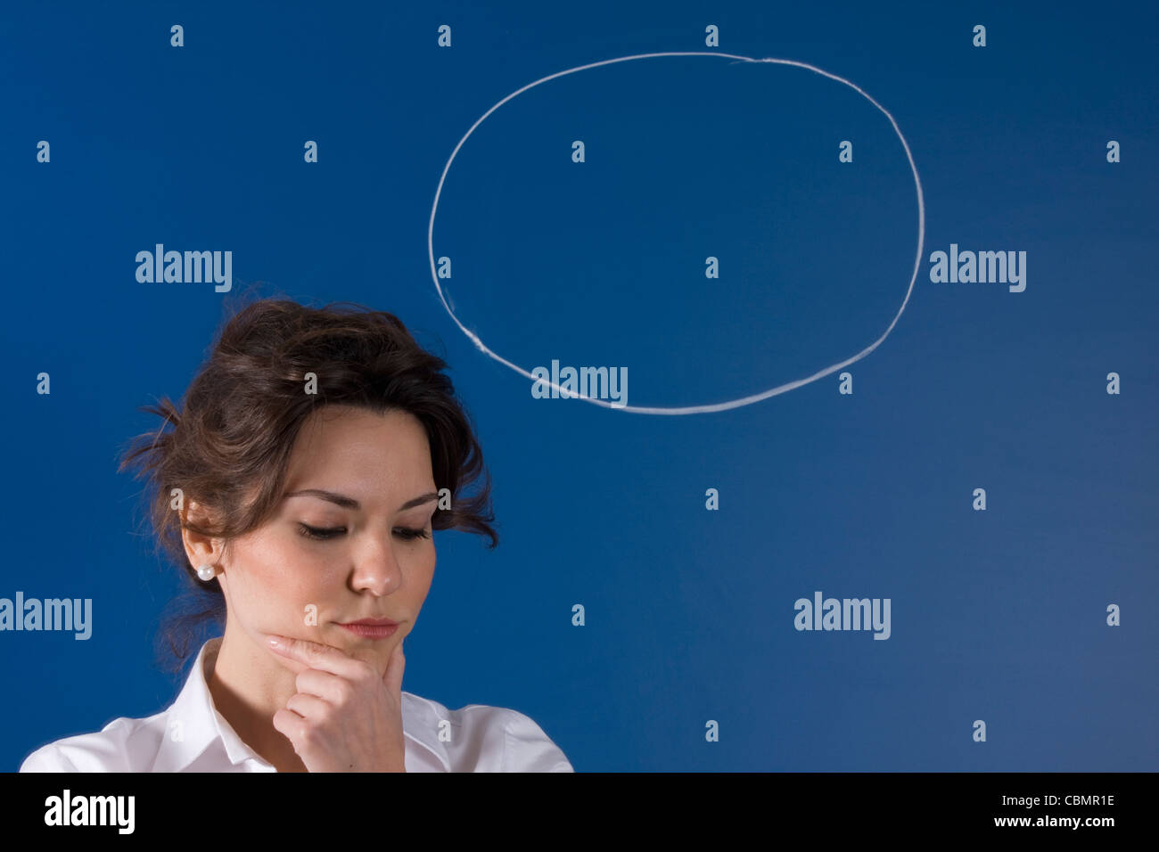 Image of young woman thinking on green board Stock Photo - Alamy
