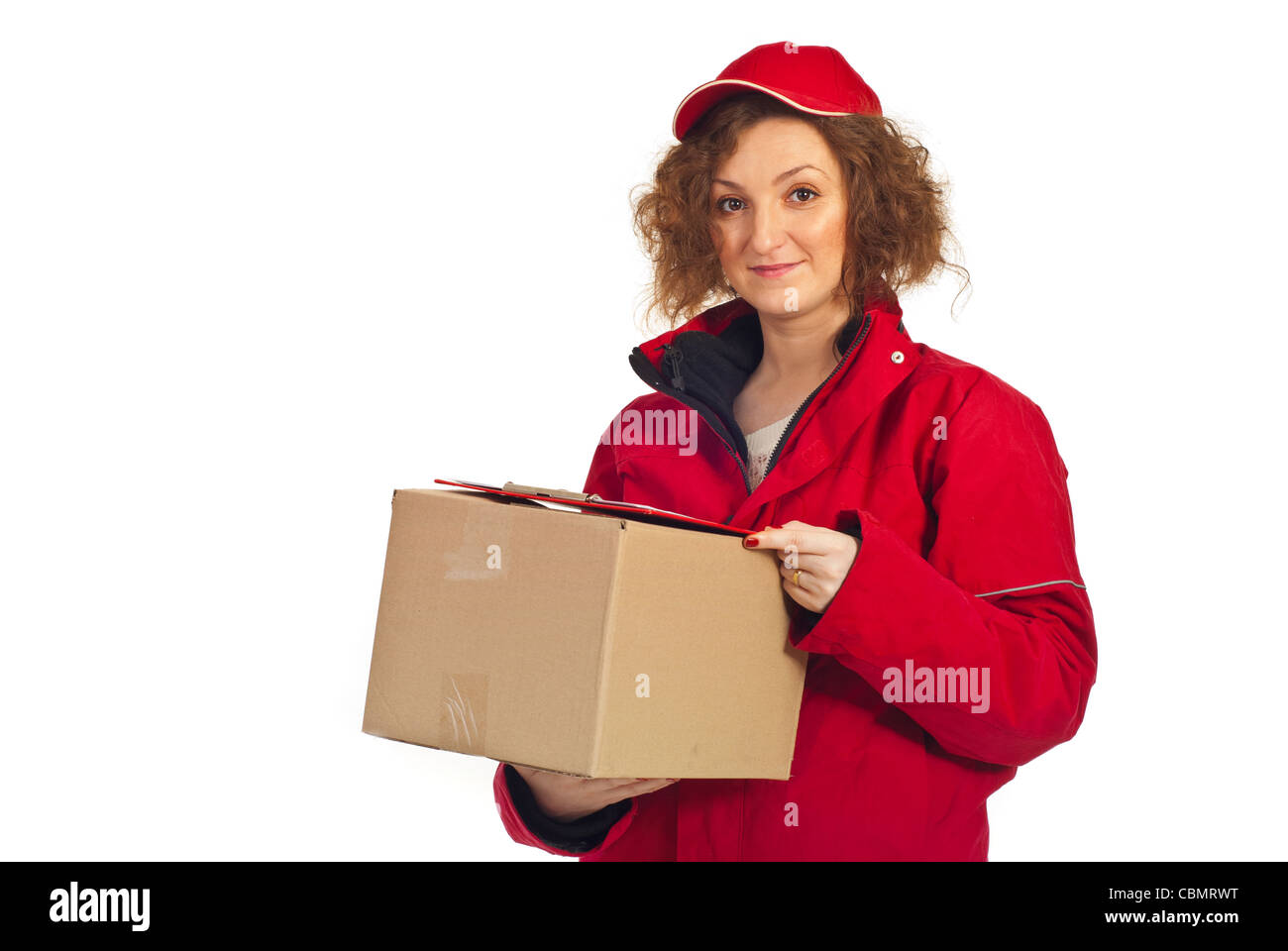 Delivery woman in red cap and coat carrying box isolated on white ...