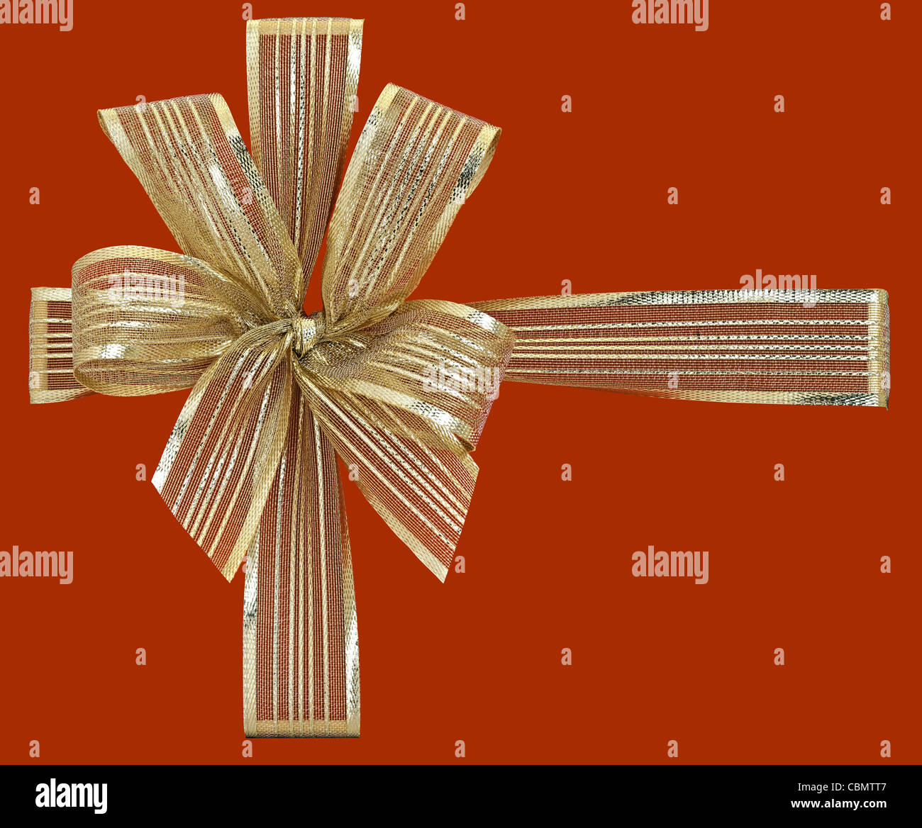 gold gift ribbon isolated on red background Stock Photo - Alamy