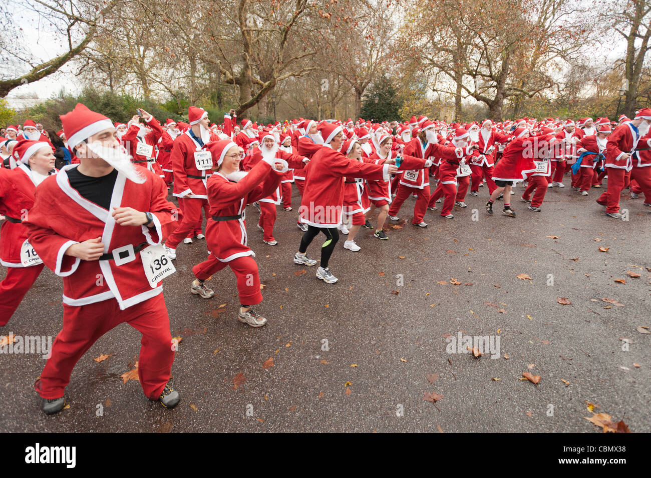 Runners dressed as Santa Claus at the Battersea Park Santa Run in ...