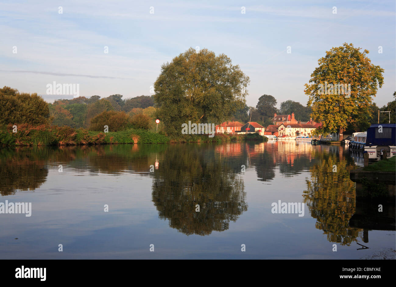 An early morning scene with reflections on the River Bure at Coltishall ...