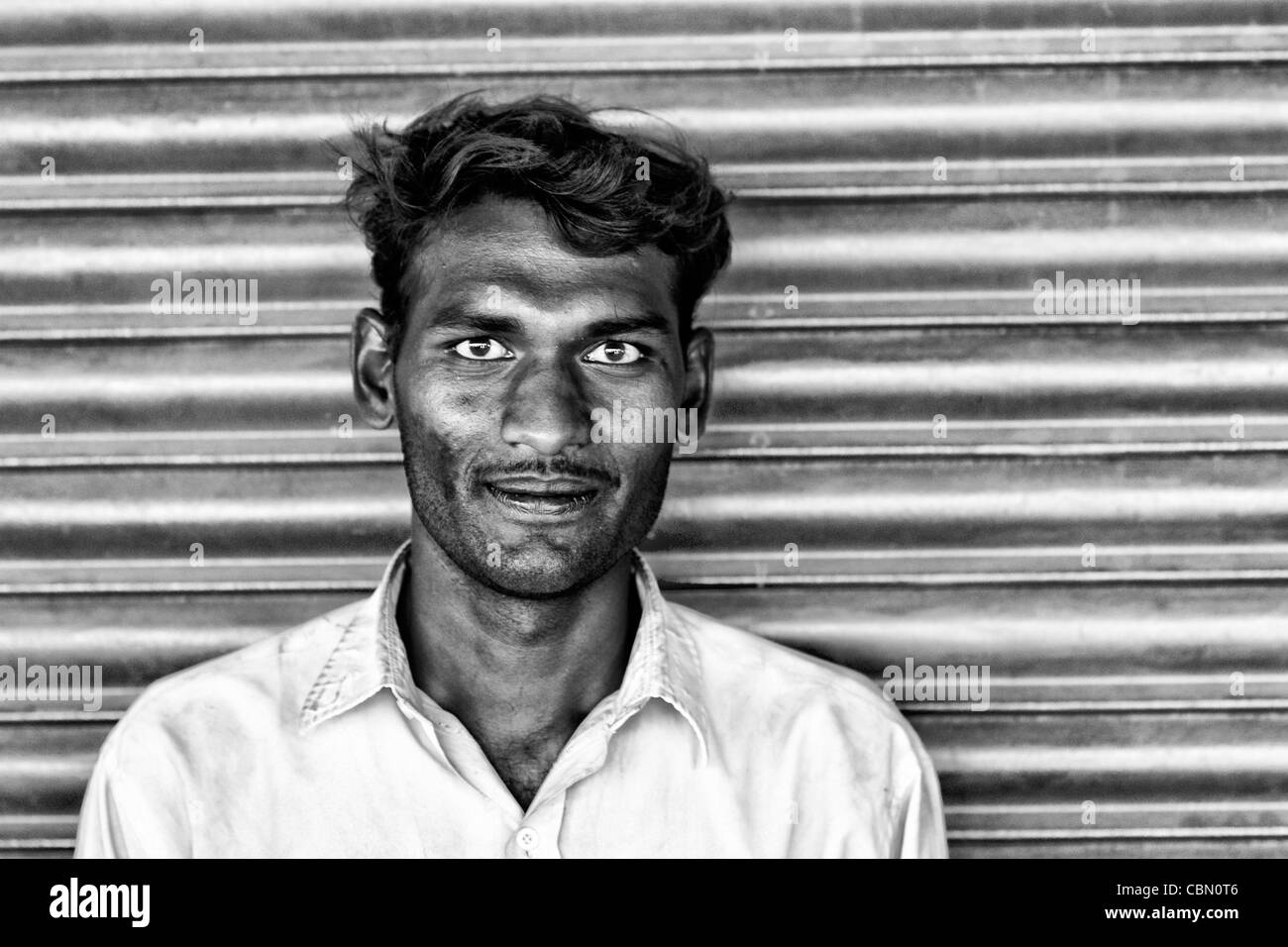 Colorful portrait of local Hindu young man in small village of Charu ...
