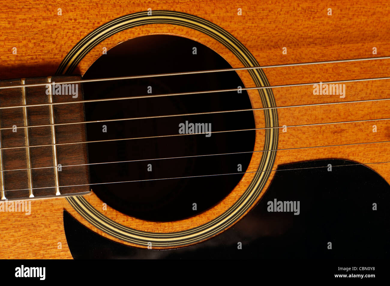 Six string acoustic guitar over the sound hole in close up Stock Photo ...