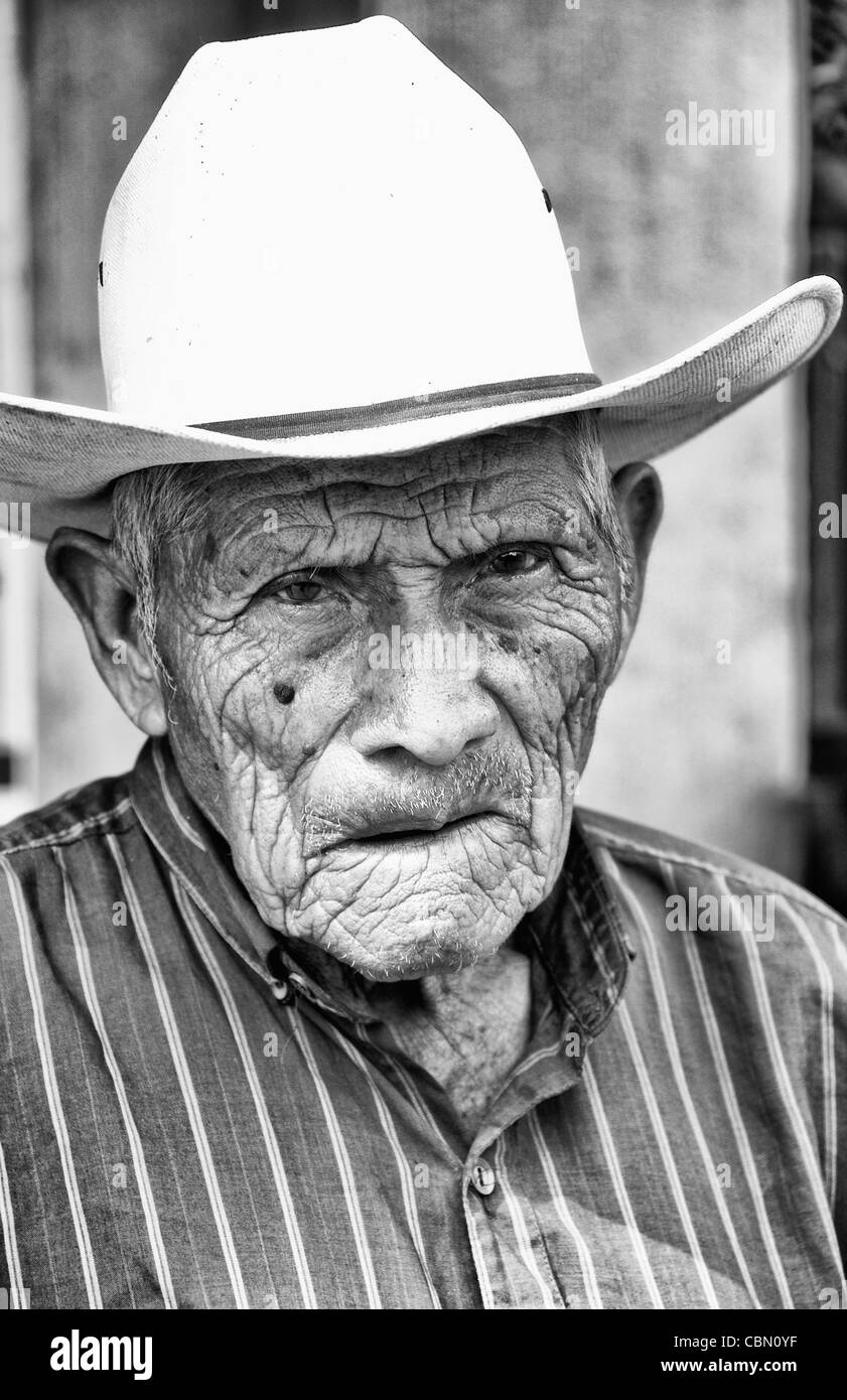 Local humble poor man portrait with cowboy hat in Lake Atitlan village ...