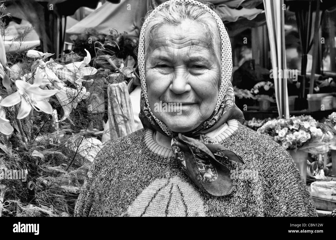 Old lady babushkas selling flowers at market in old town center city of ...