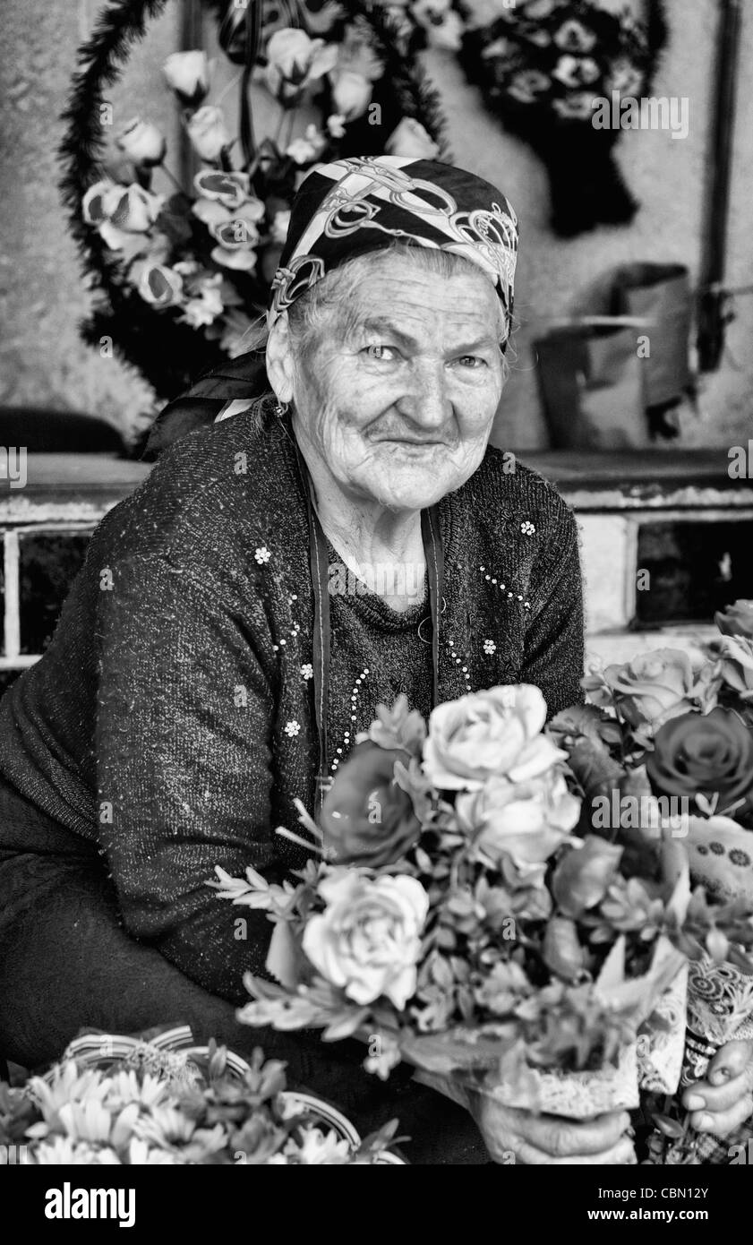 Old lady babushkas selling flowers at market in old town center city of ...