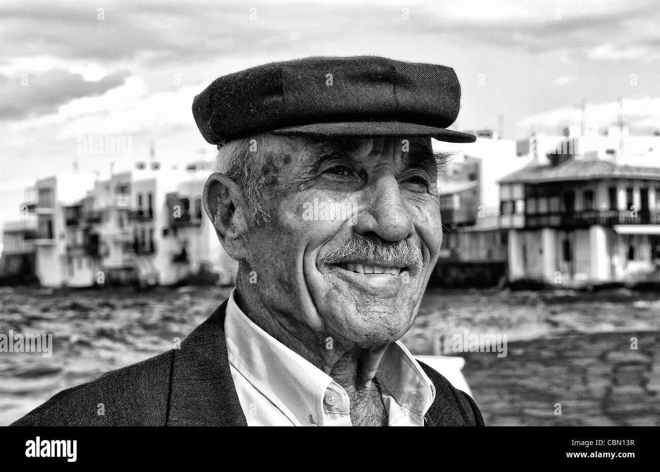 Local man with Greek hat scene in downtown near beach with famous ...