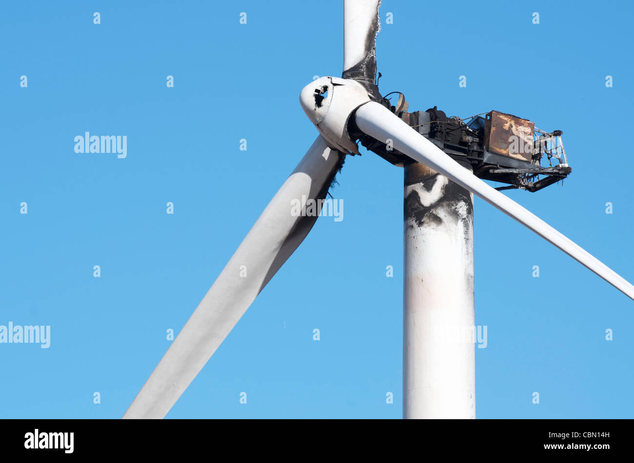 fire at the top of a windmill for renewable electric energy production ...