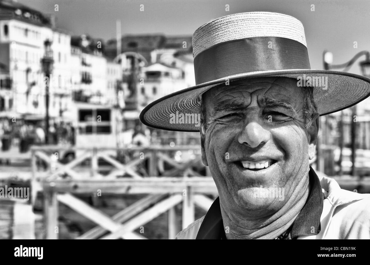 Venice Venezia Italy gondola driver with red straw hat for tourists on ...