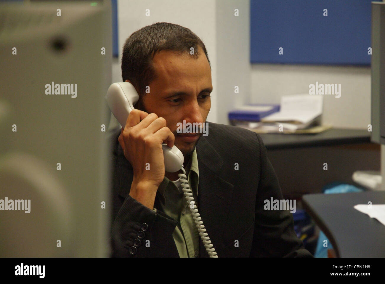 Al Jazeera Television newsroom with reporters and editors researching ...