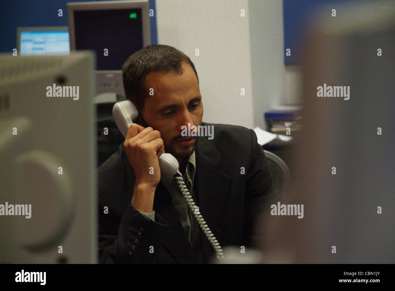 Al Jazeera Television newsroom with reporters and editors researching ...