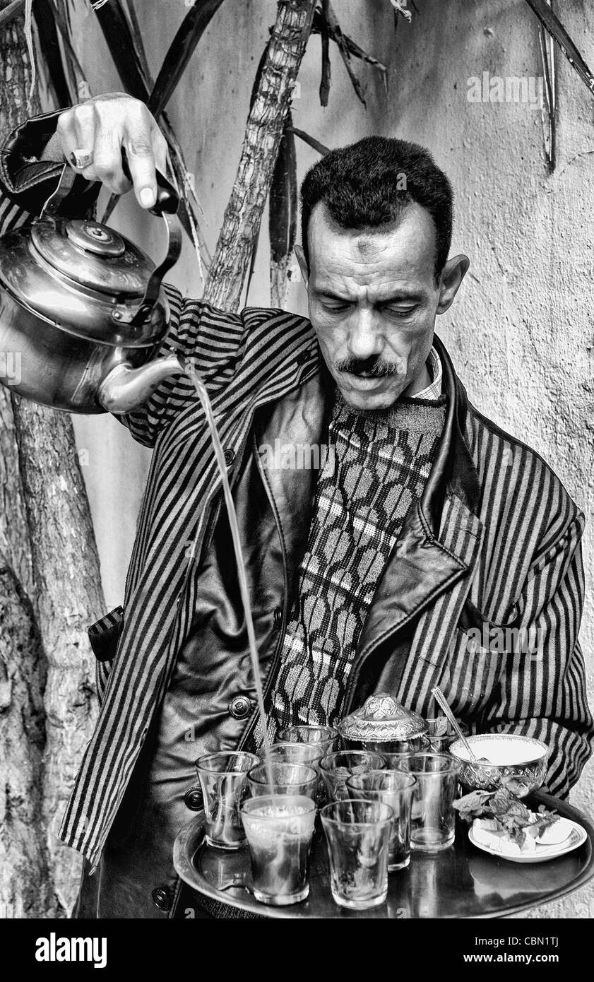 Man pouring tea Black and White Stock Photos & Images - Alamy