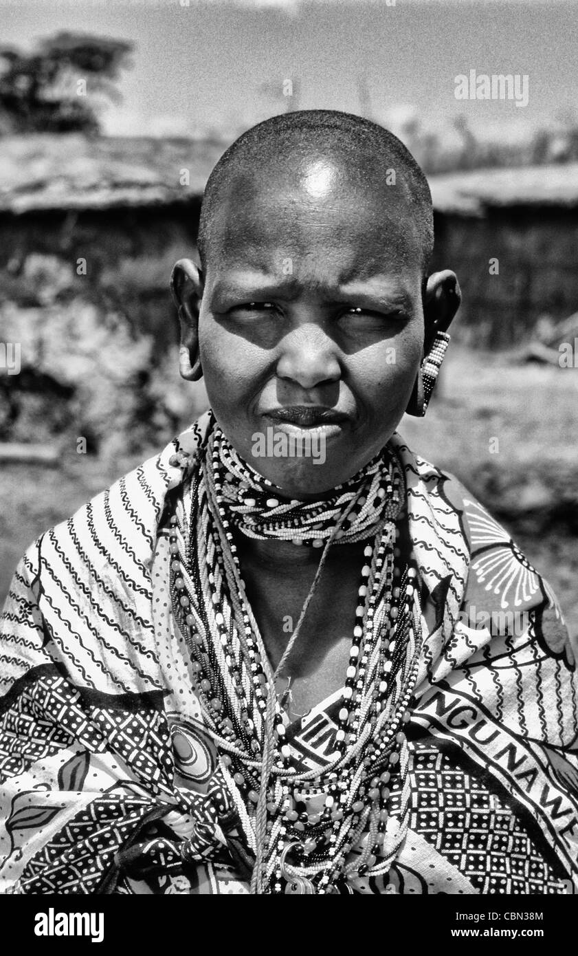Maasai tribe dark woman in costume traditional dress in jungles near ...