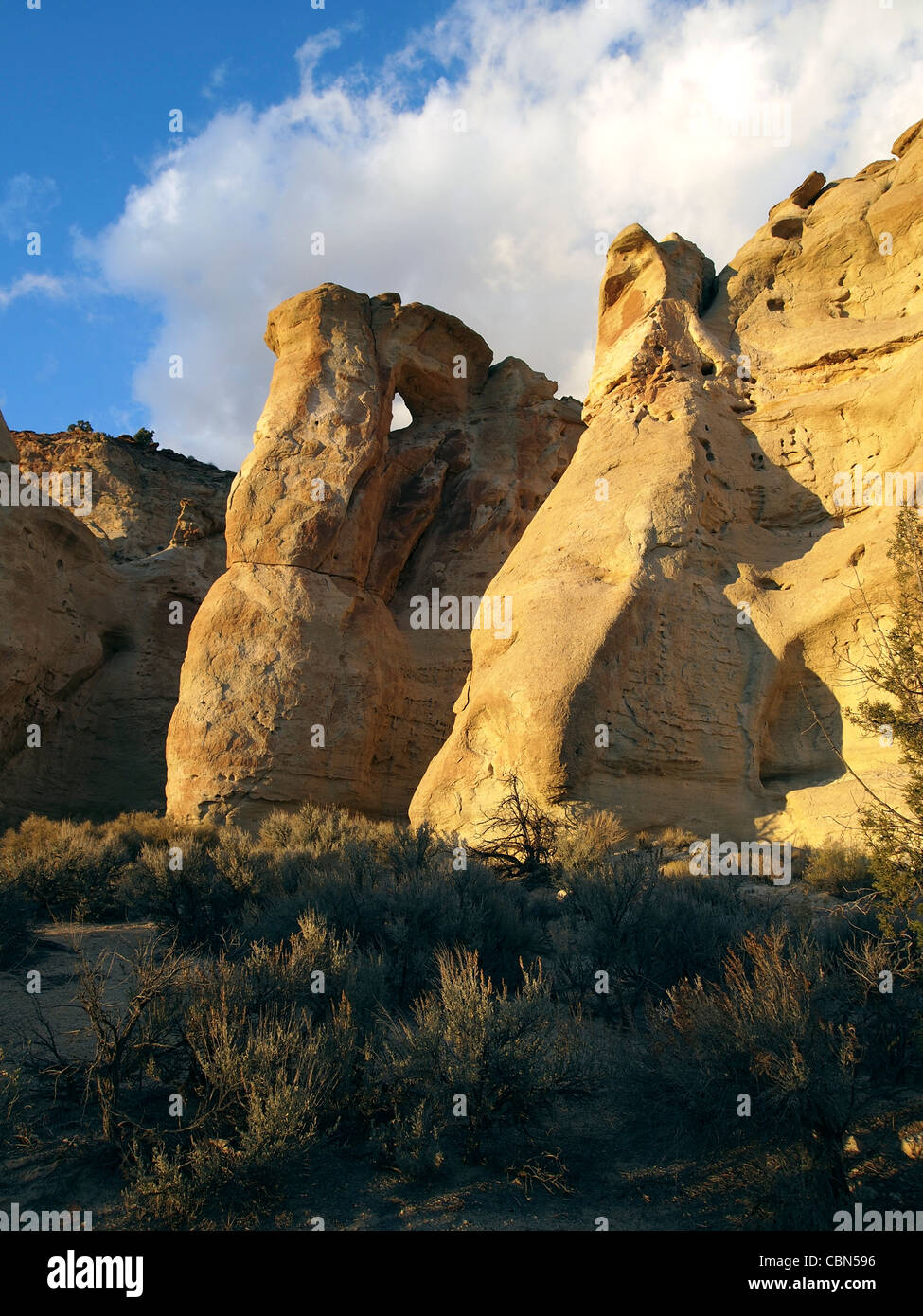 A white sandstone formation with a small arch Stock Photo - Alamy