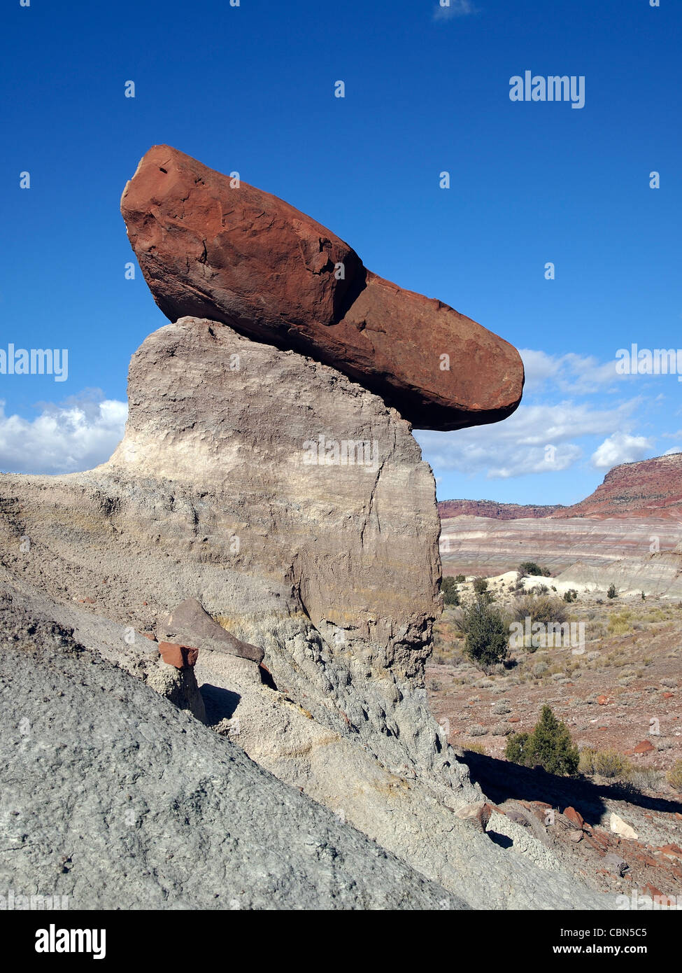 A red sandstone block atop a white sandstone pedestal Stock Photo - Alamy