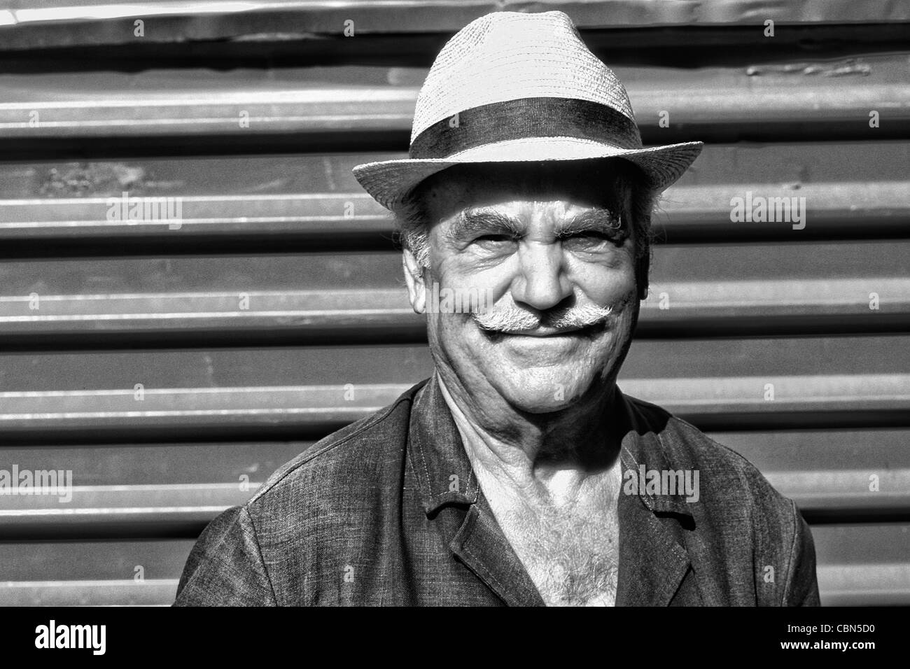 Olympics 2004 Athens Greece Close Up of Native Man with Blue Wall Stock ...