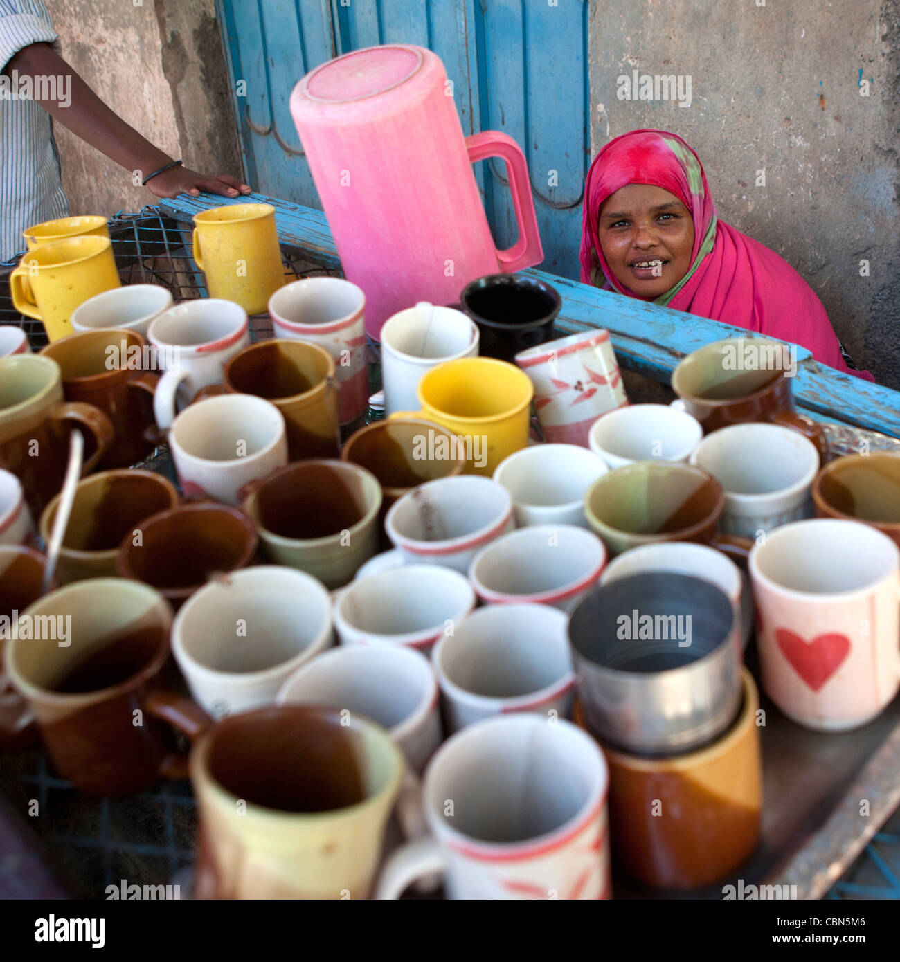 Hatful Of Dirty Mugs In Cafe Young Woman Sat Boorama Somaliland Stock ...