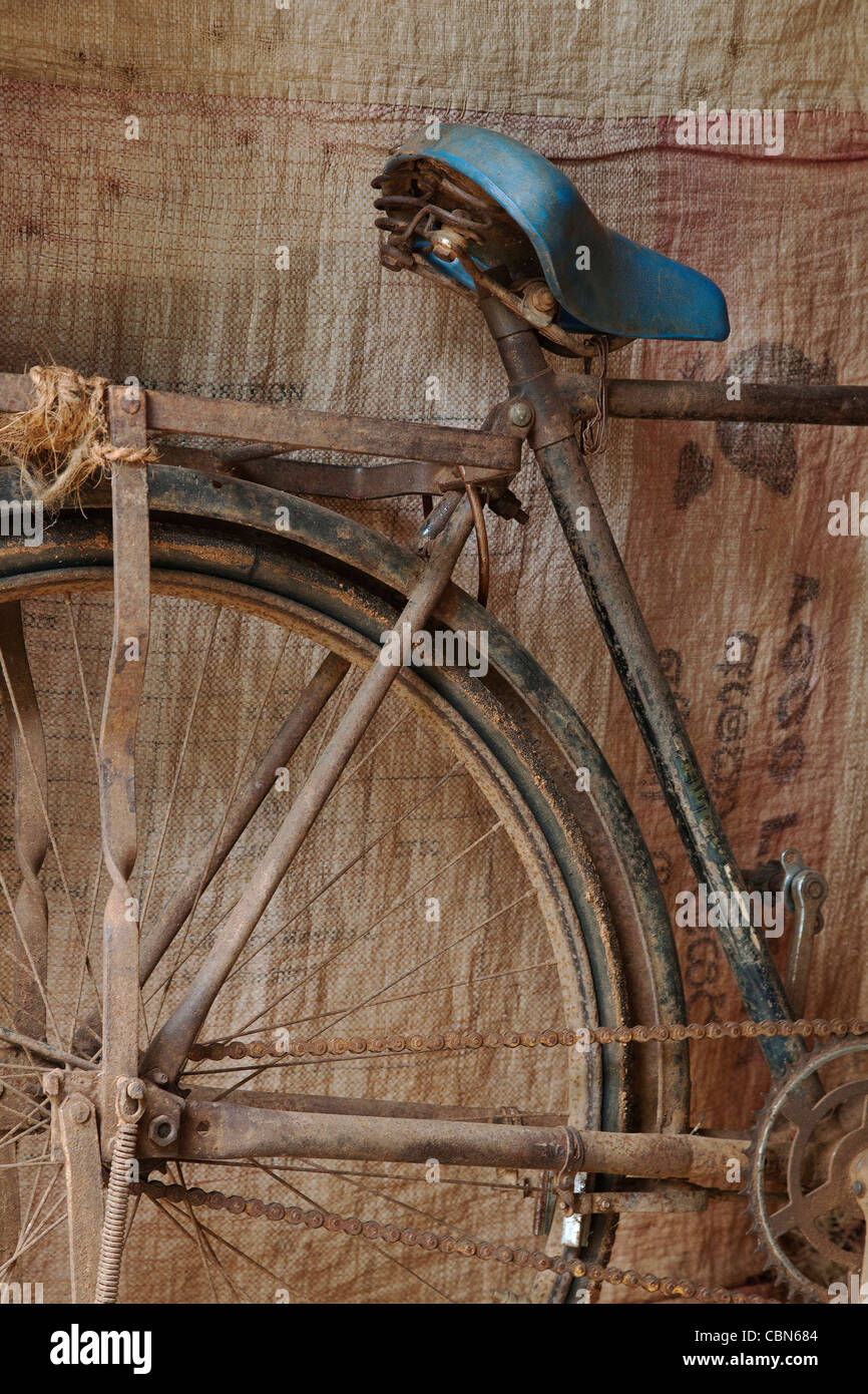 A rusting bicycle with a blue saddle Stock Photo - Alamy