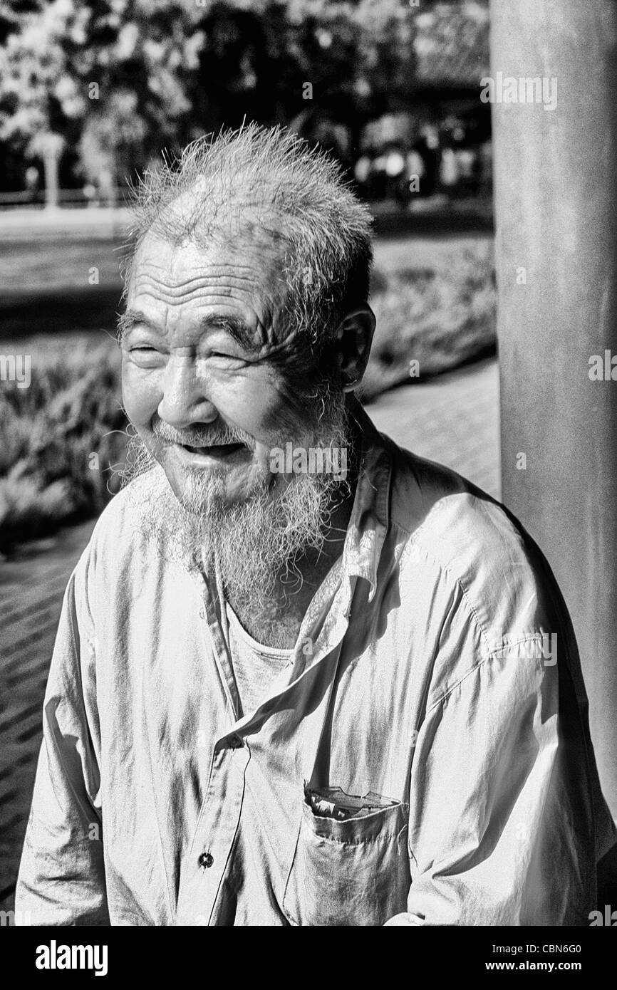 Colorful portrait of elderly Chinese man with beard in Beijing China ...