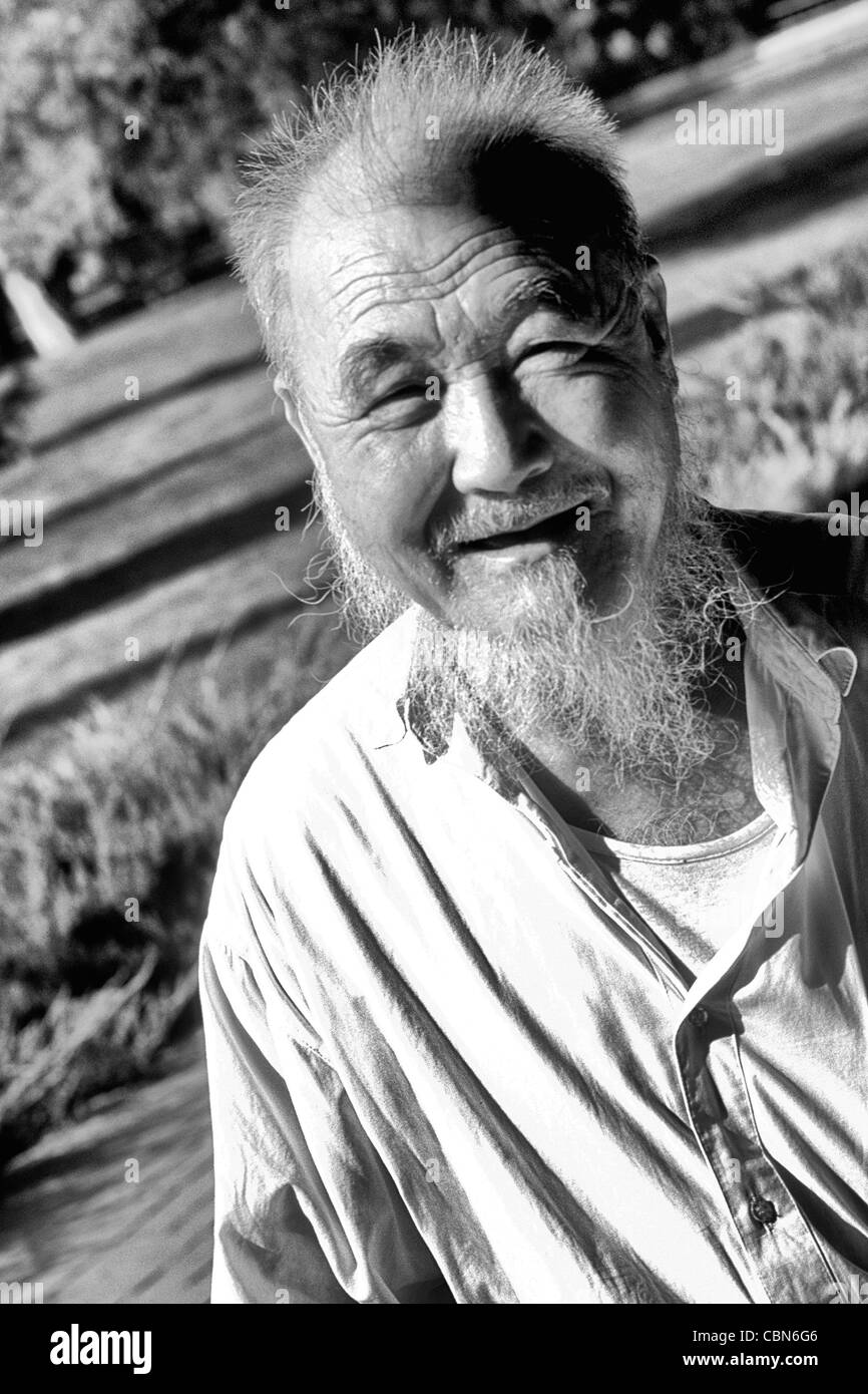 Colorful portrait of elderly Chinese man with beard in Beijing China ...