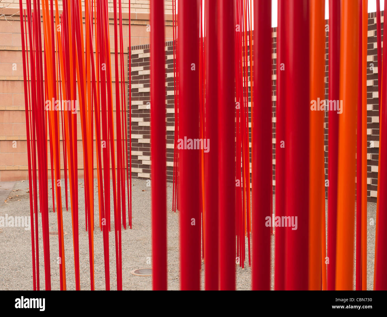 Red modern sculpture in the city Stock Photo - Alamy