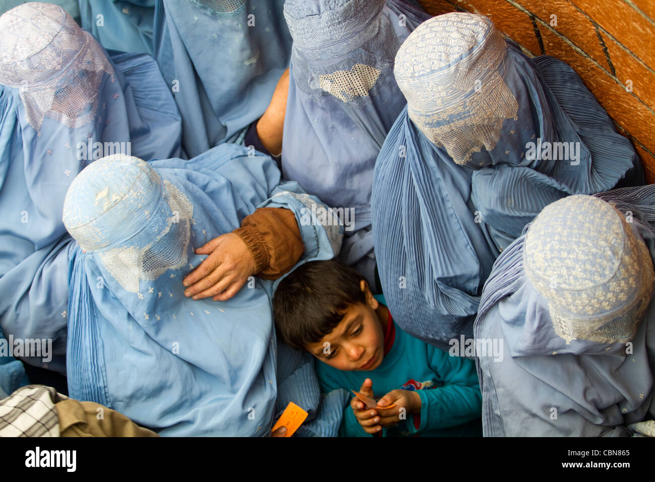 Women in burqa waiting aid for Feast of Sacrifice Kabul Afghanistan ...