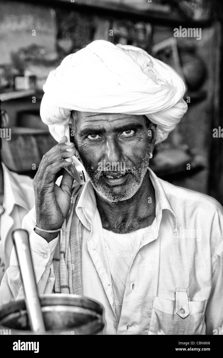 Traditional Hindu vendor man with white turban portrait using modern ...