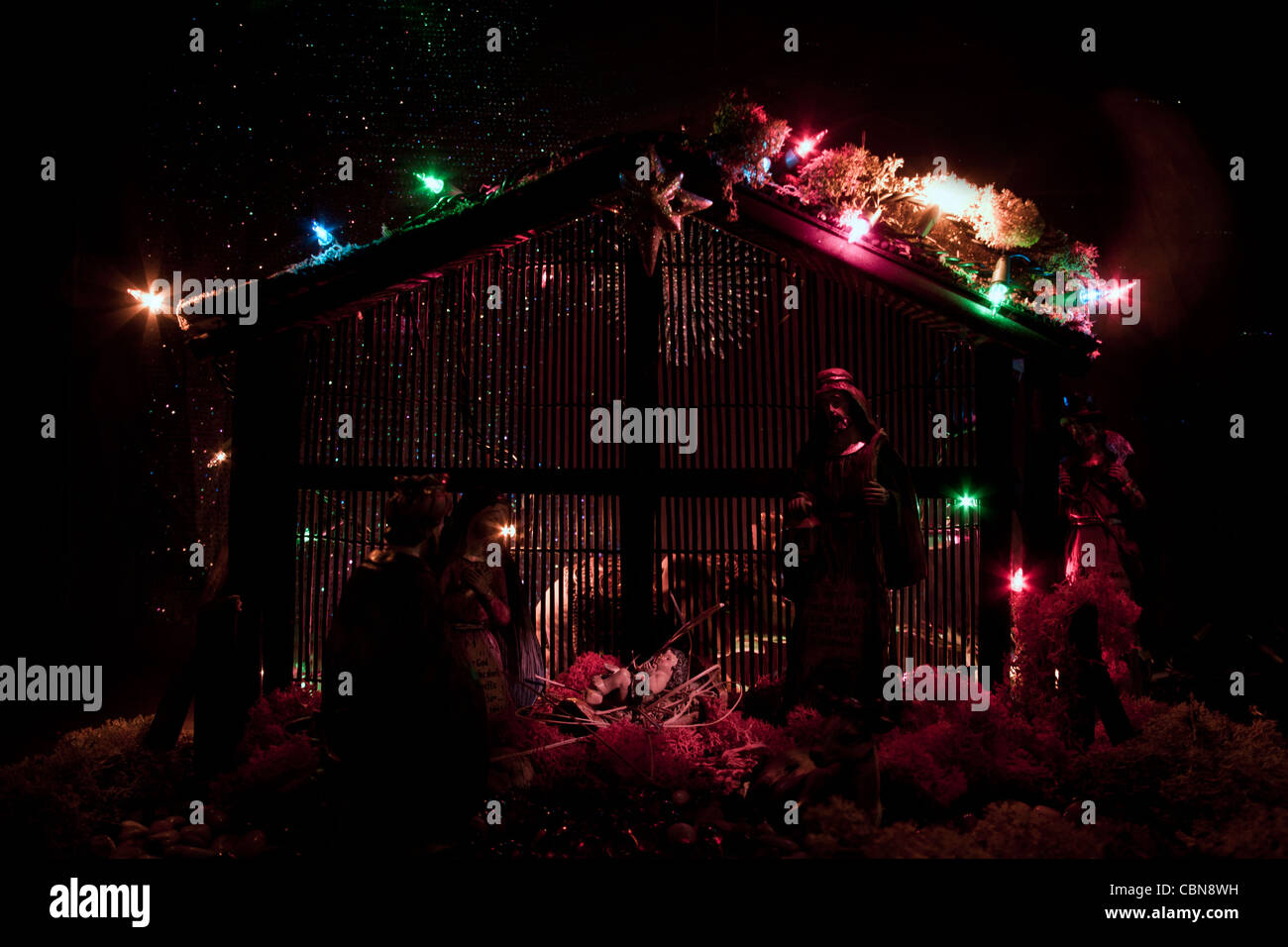 Colorfully Nativity Scene lit at night for the holidays Stock Photo - Alamy