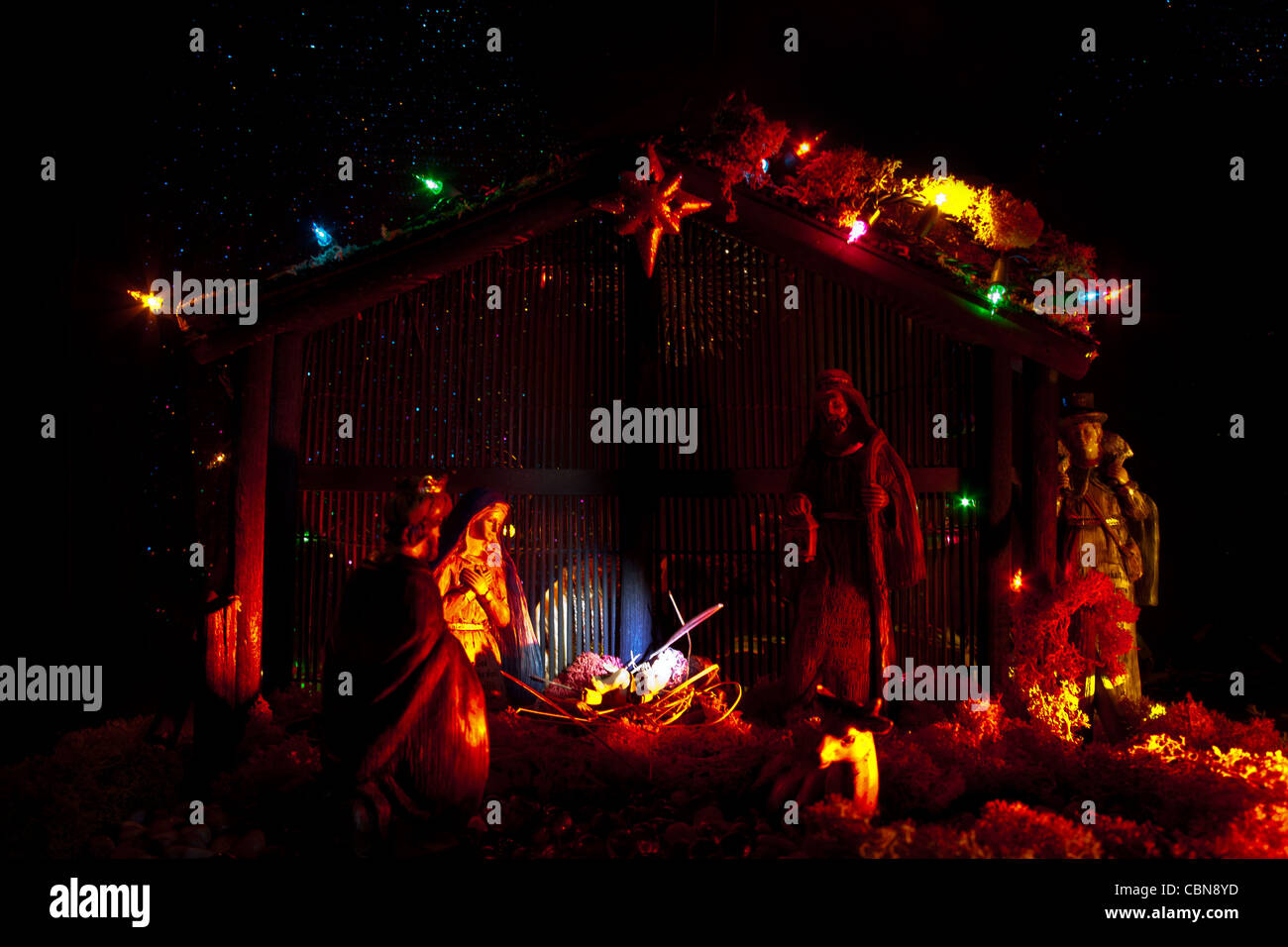 Colorfully lit Nativity Scene for the holidays Stock Photo - Alamy