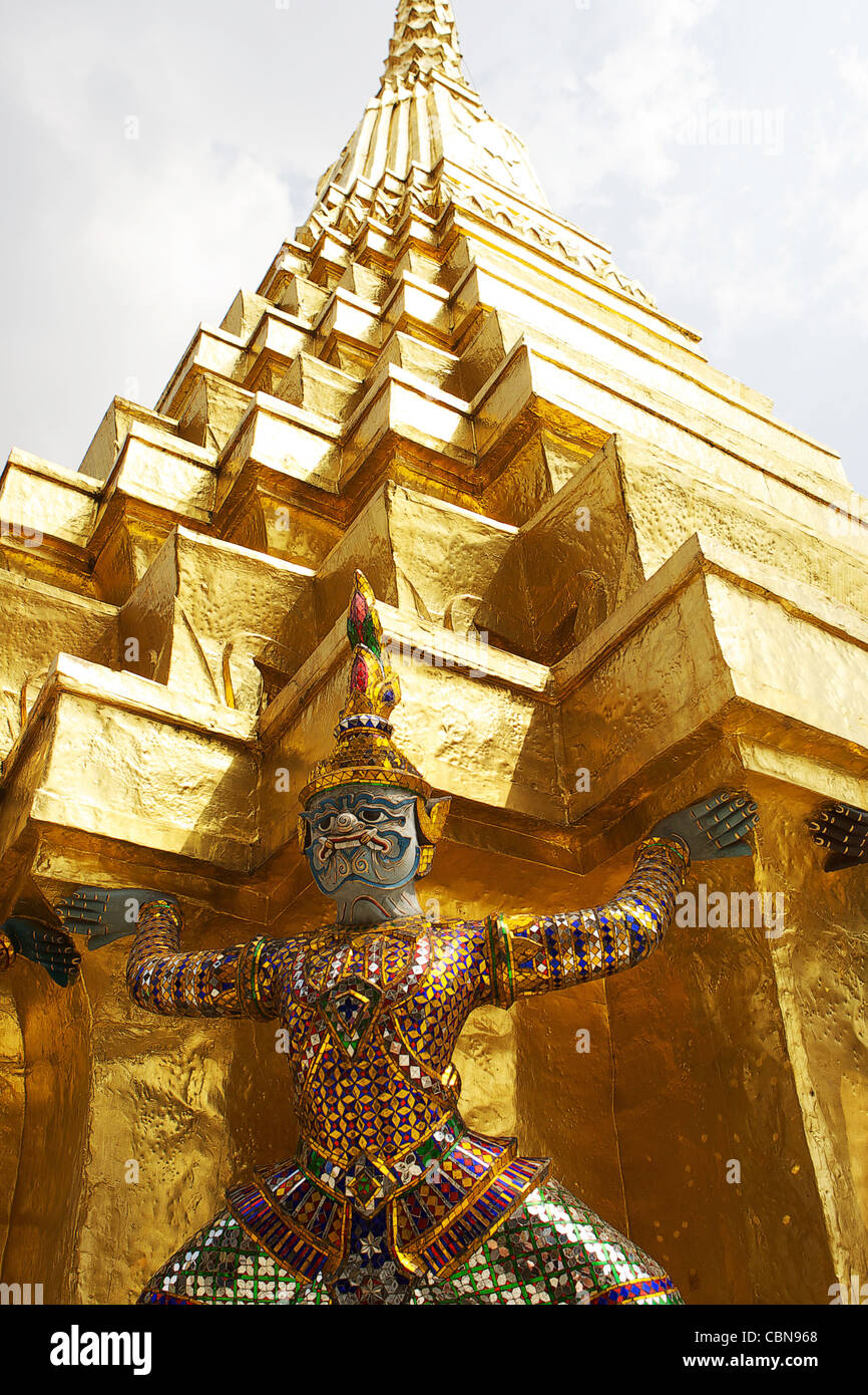 Supporting a tall golden structure within the Grand Palace, Bangkok ...
