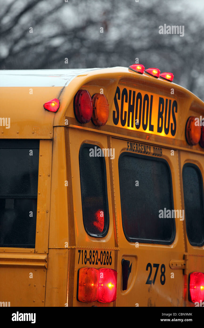 Yellow American School Bus, parked on street outside of school, New ...