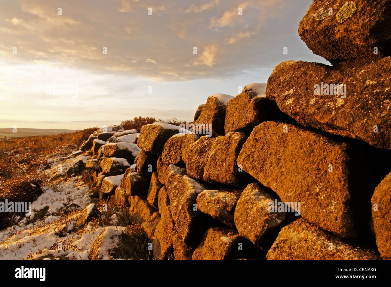 Sunrise hitting a gritstone wall at Baslow Edge Peak District Stock ...