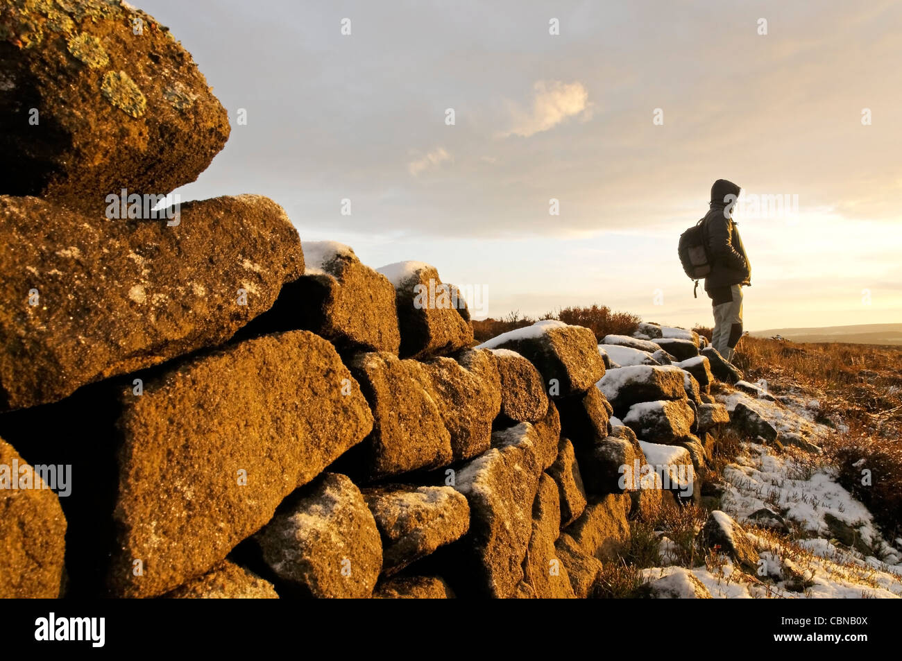 Sunrise hitting a gritstone wall at Baslow Edge Peak District Stock ...